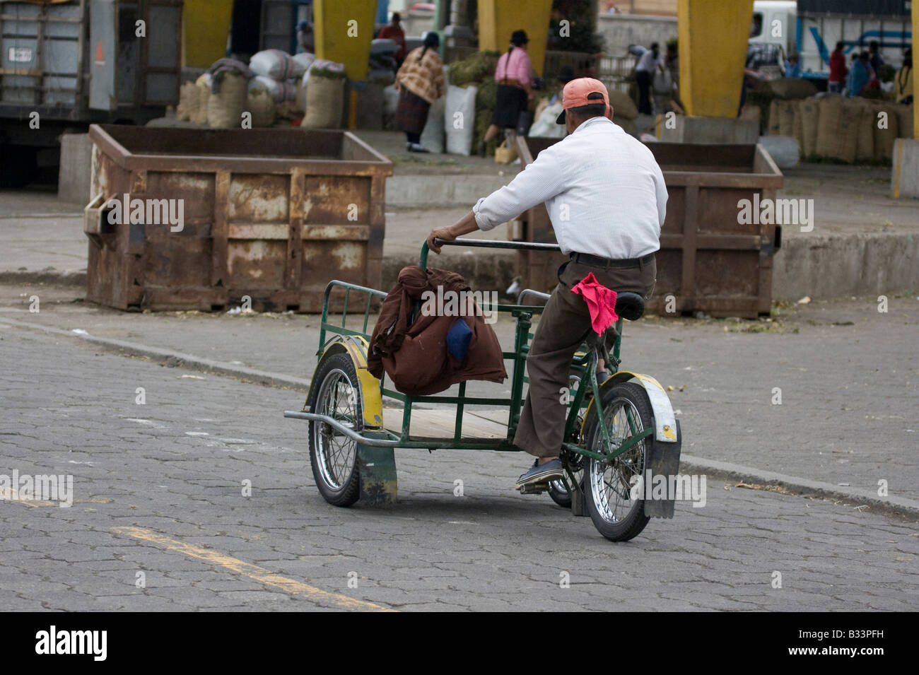 Man riding a tricycle in Otavalo Market.71568 Ecuador Stock Photo - Alamy