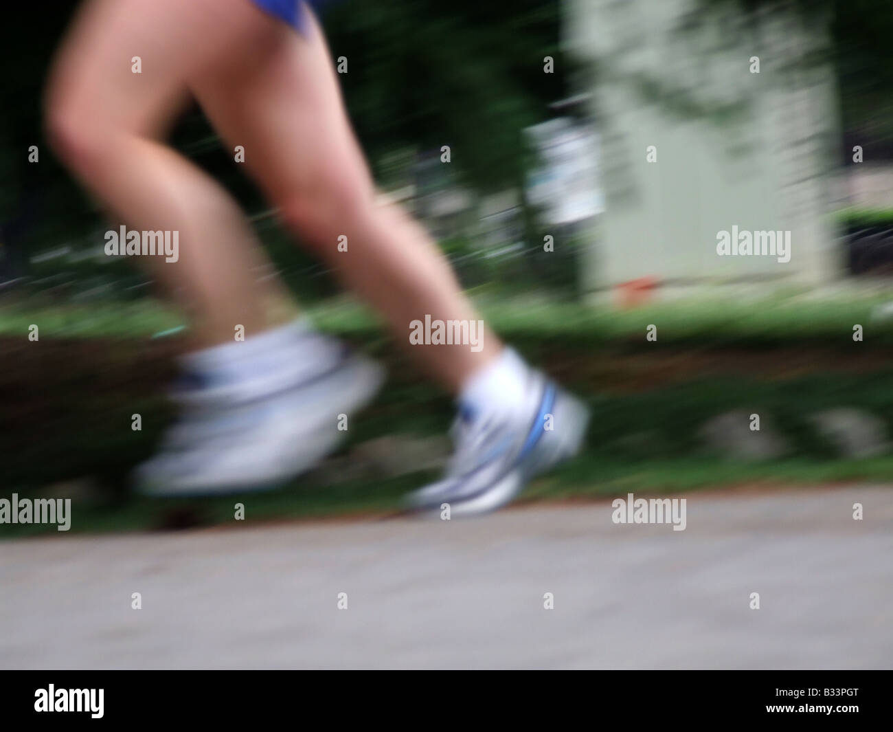 abstract feet of fast runner in park Stock Photo - Alamy