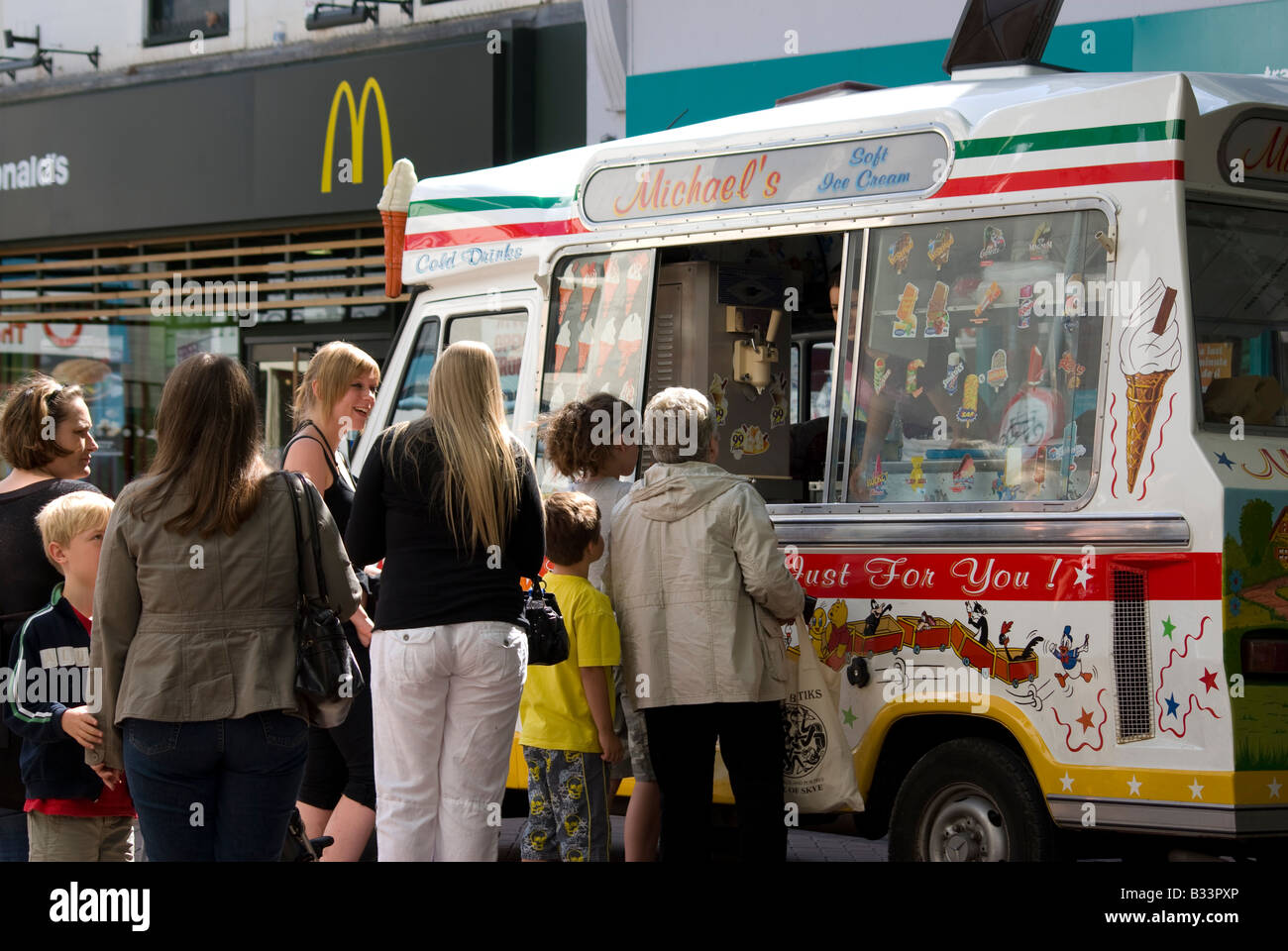 Queue for the ice cream van outside Macdonalds, Mansfield, Notts Stock ...