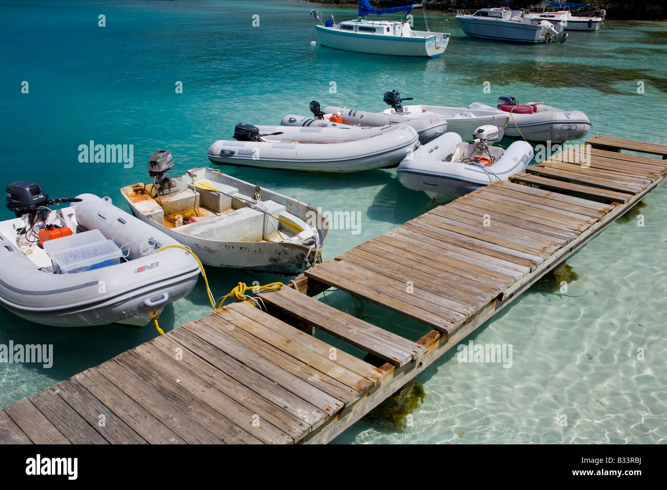 Dinghies tied up at dock in Cruz Bay on the caribbean island of St John ...
