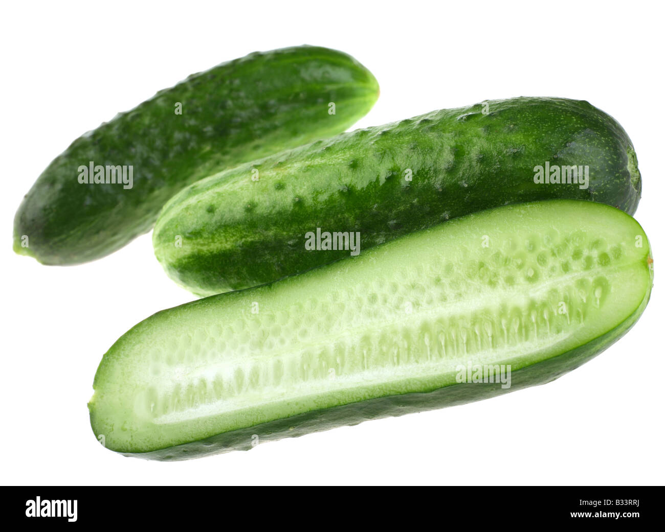 Green cucumber group isolated on white background Stock Photo - Alamy