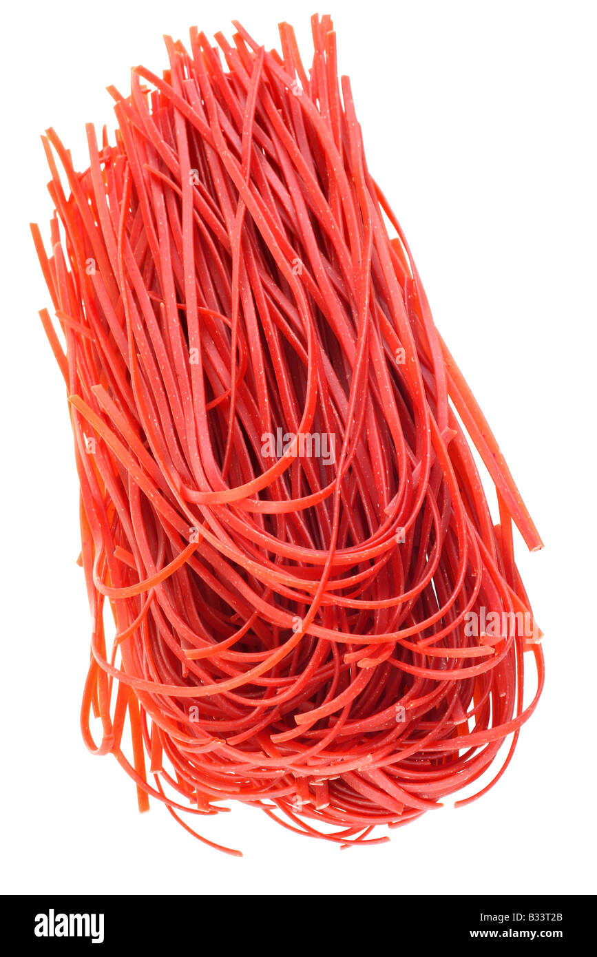 Red pasta detail isolated on white background Stock Photo - Alamy