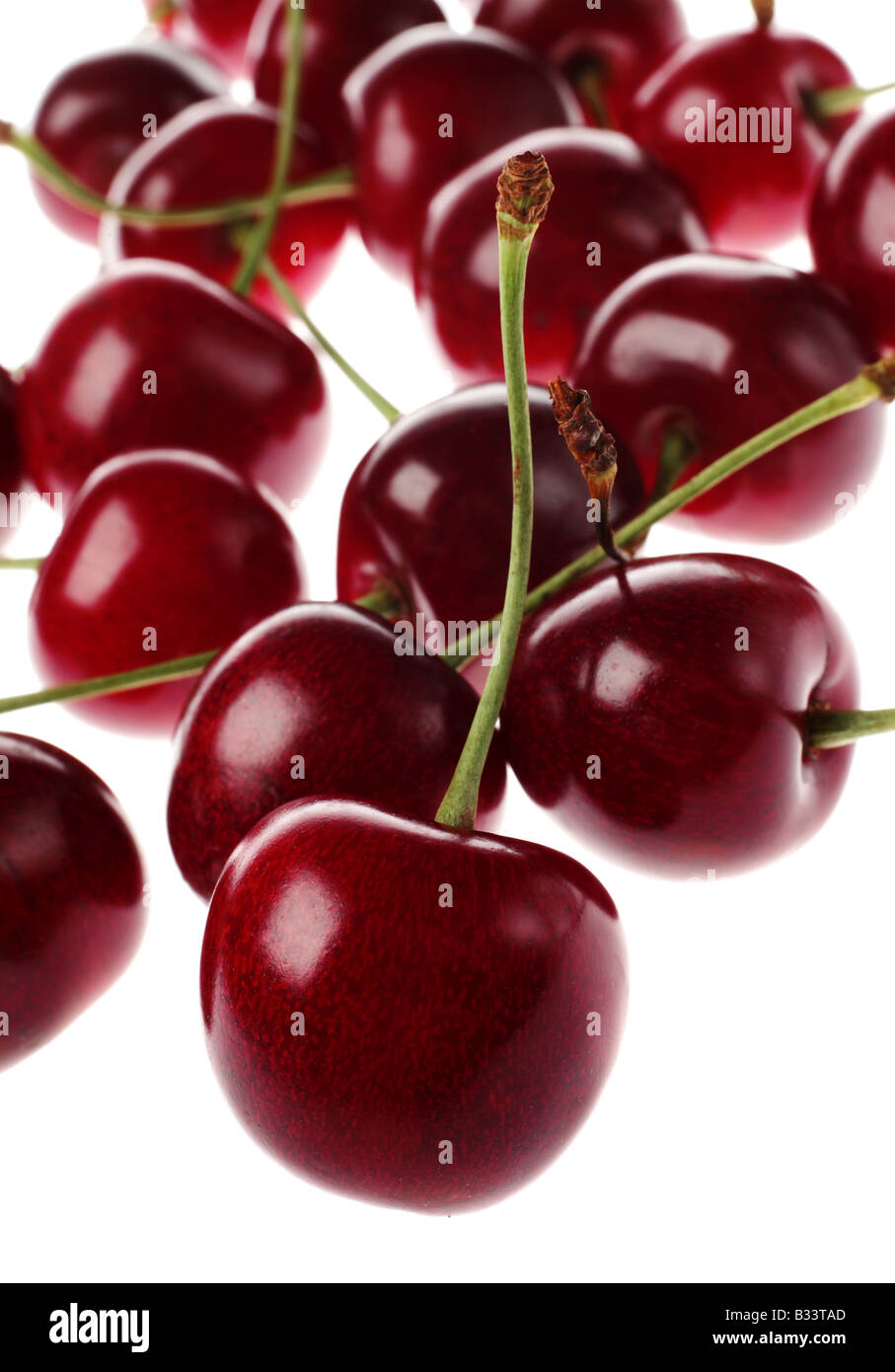 Red cherry closeup group on white background Stock Photo - Alamy