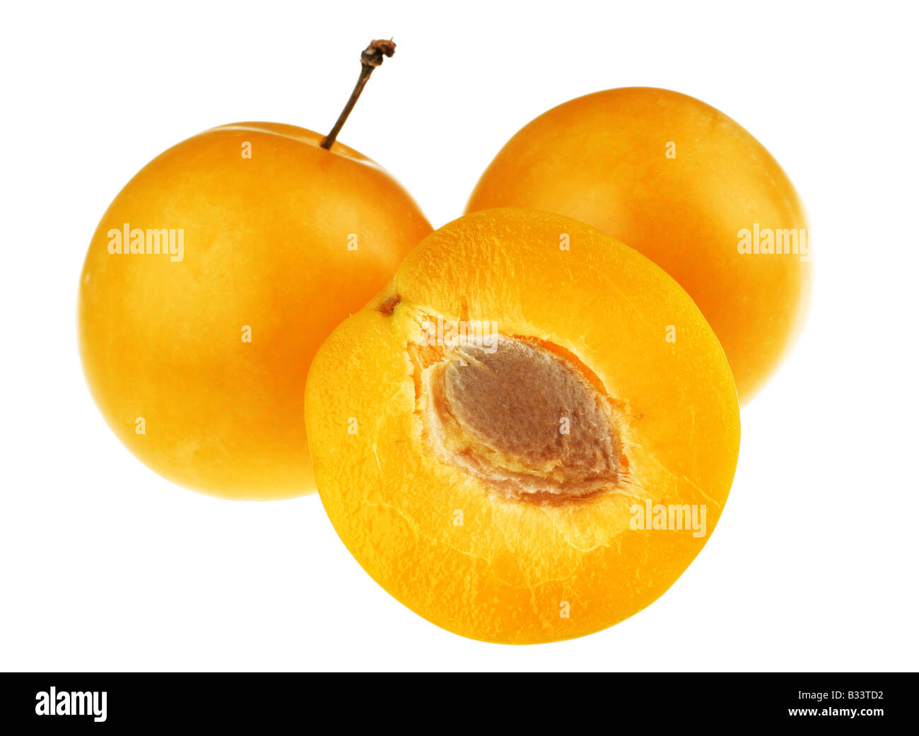 Detail plum with slice on white background Stock Photo - Alamy