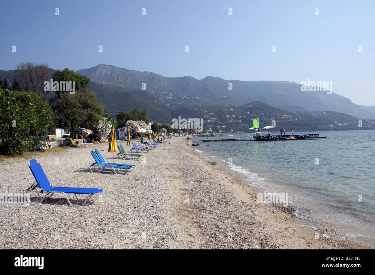 THE SANDY BEACH AT THE RESORT OF IPSOS ON THE EAST COAST OF CORFU ...