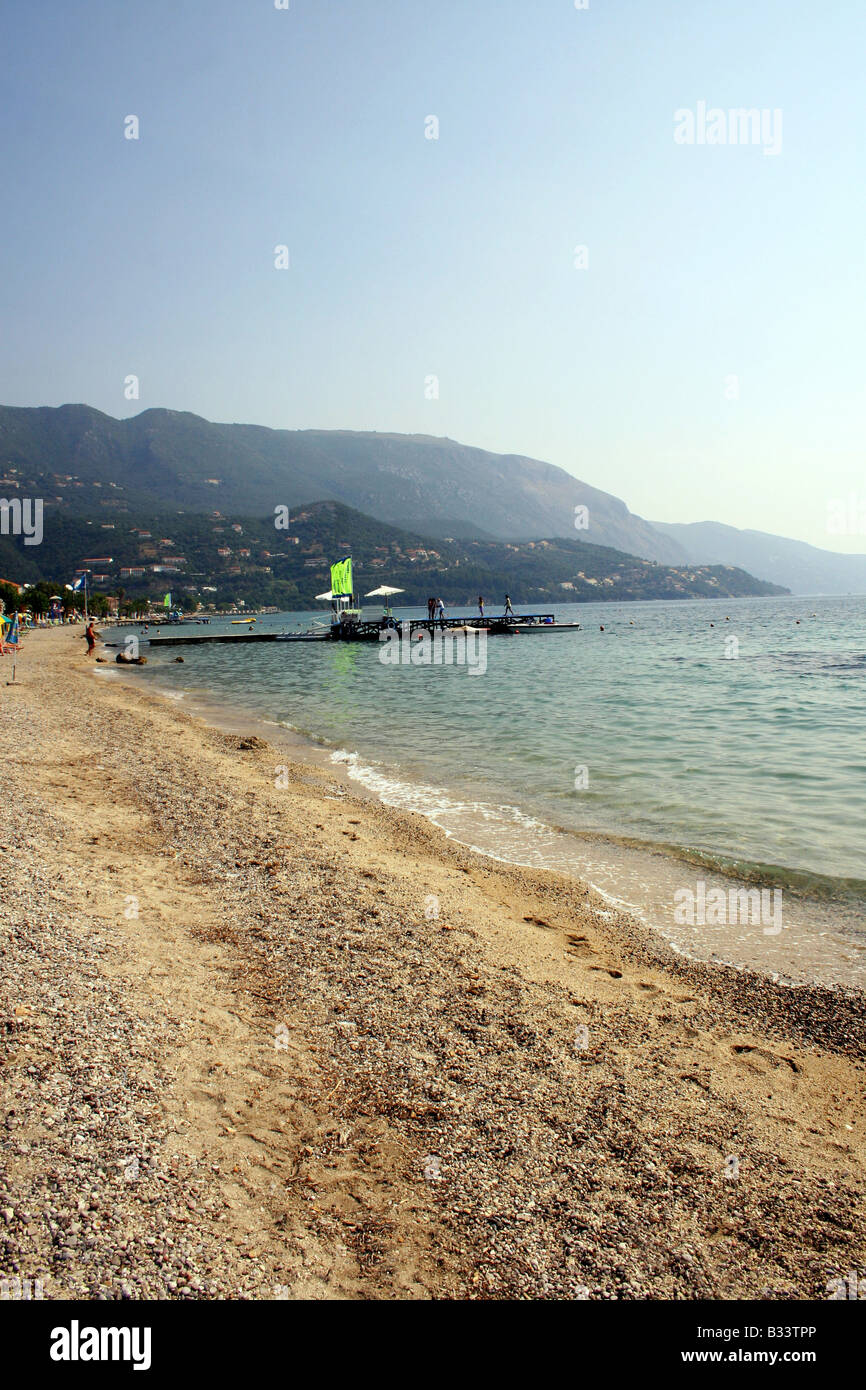 THE SANDY BEACH AT THE RESORT OF IPSOS ON THE EAST COAST OF CORFU ...