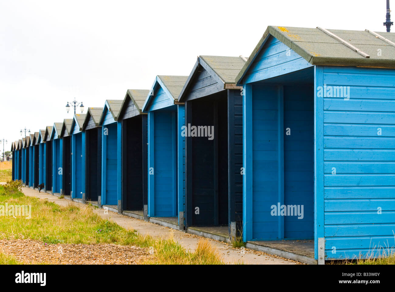 a row of wooden beach huts in southsea, portsmouth, painted blue Stock ...