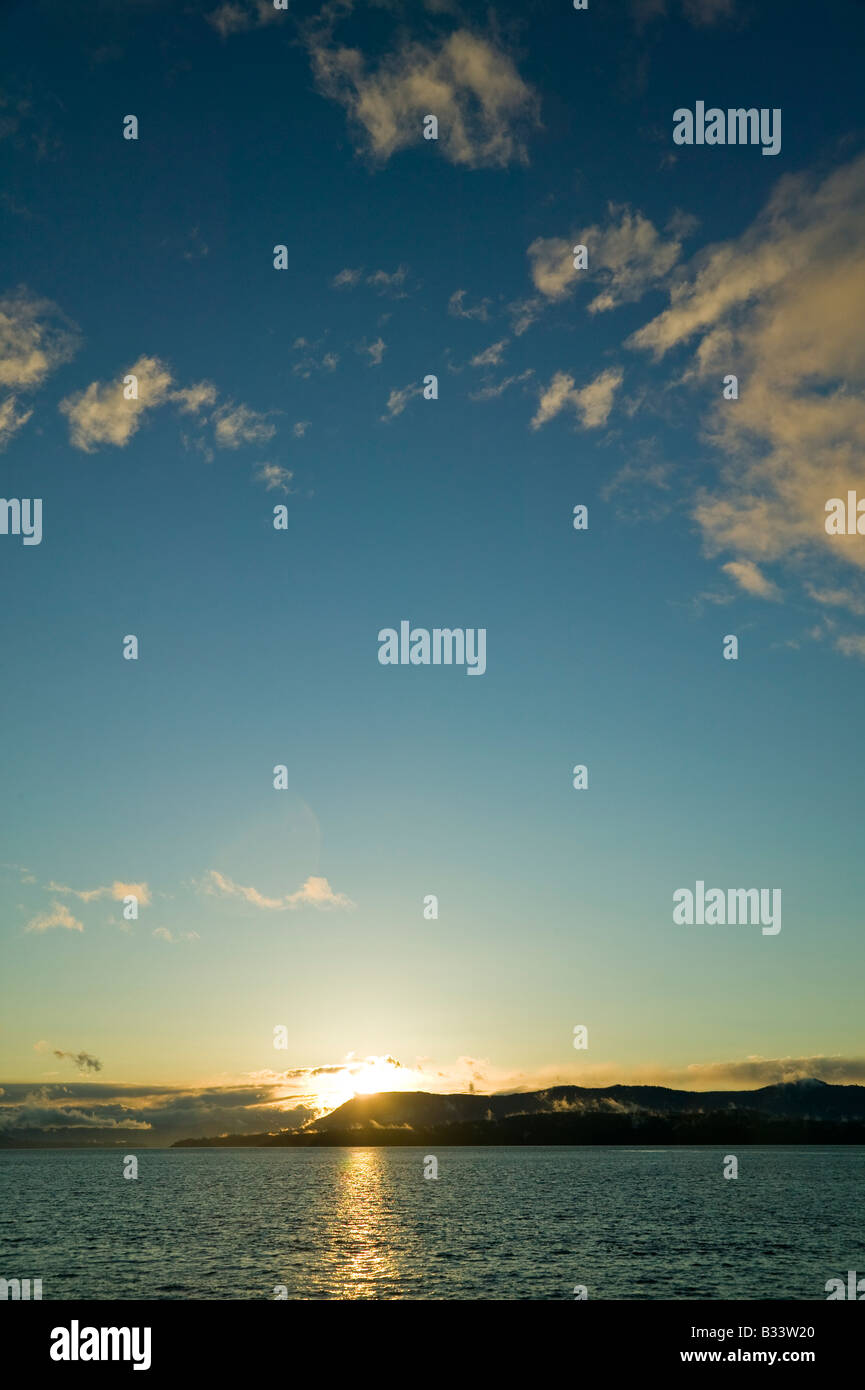 Late evening light on a island and dramatic clouds Stock Photo - Alamy