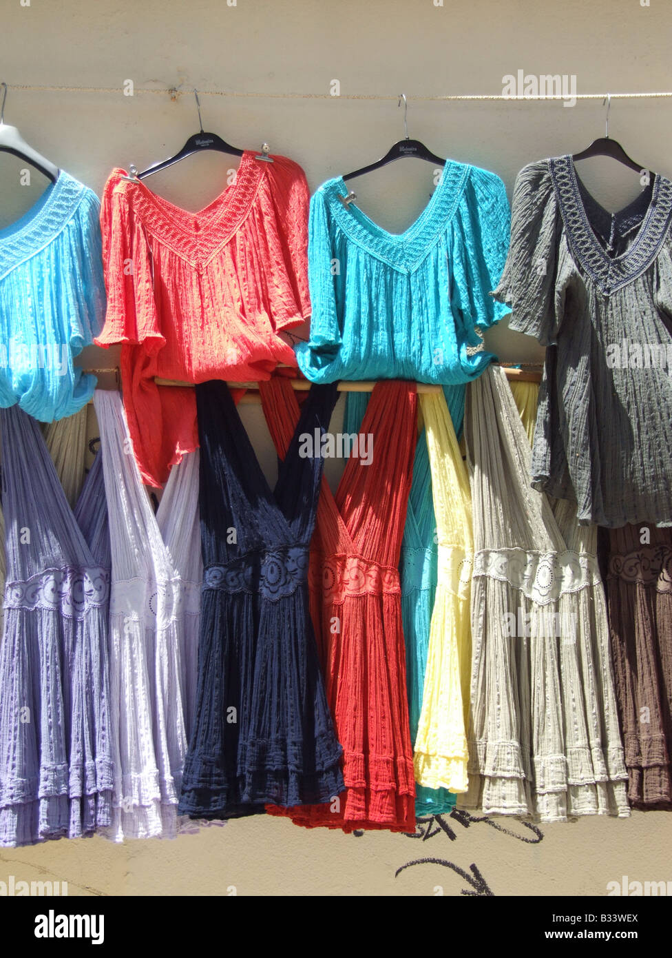colourful dresses on market stall in athens greece Stock Photo - Alamy