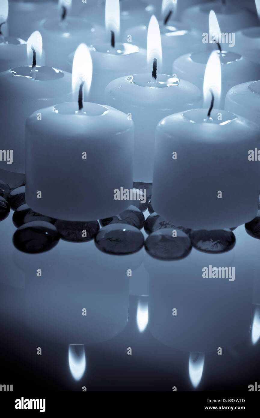 Many candles one candle lit hi-res stock photography and images - Alamy