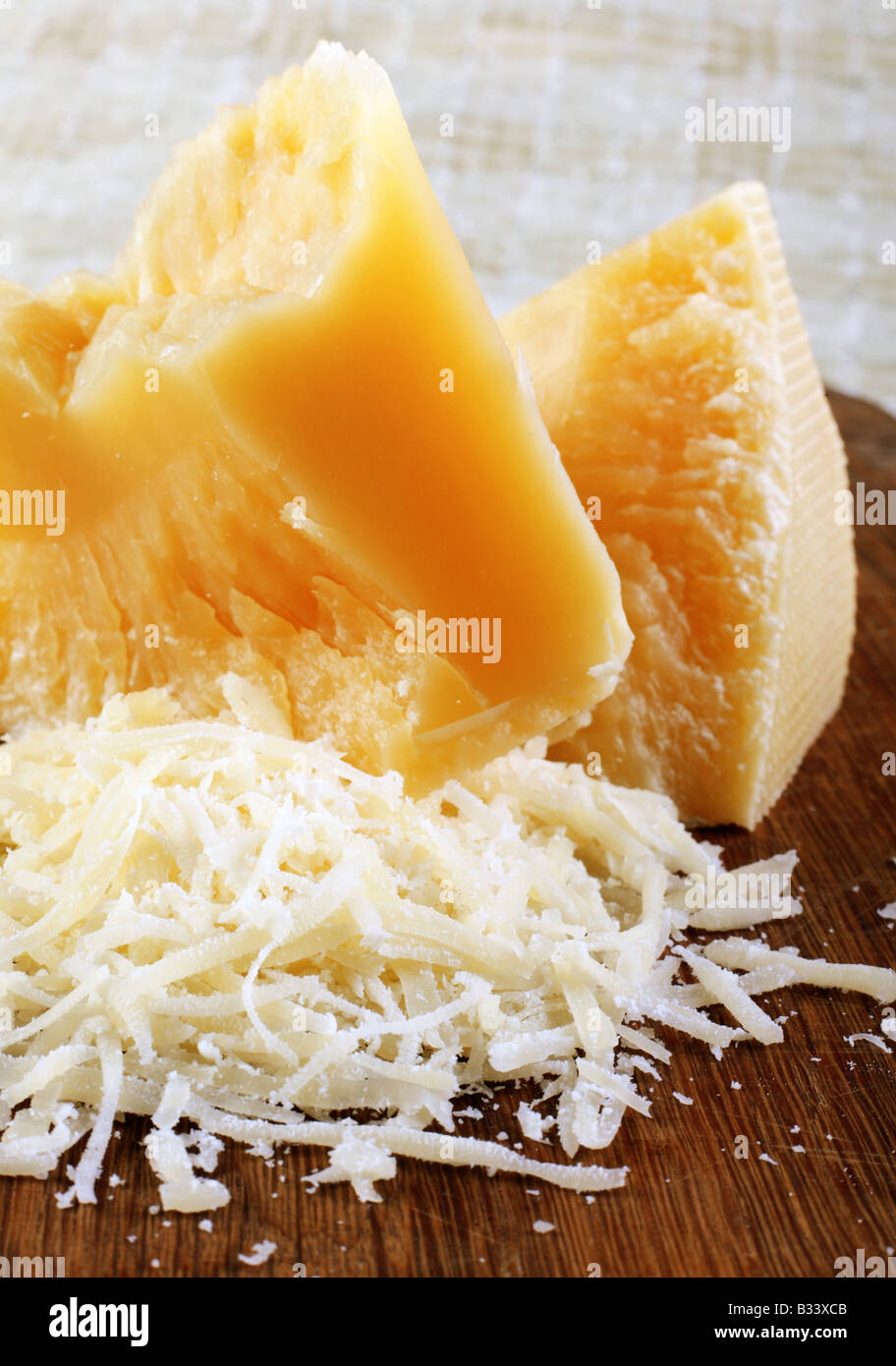 Dairy product parmesan cheese broken closeup view Stock Photo - Alamy