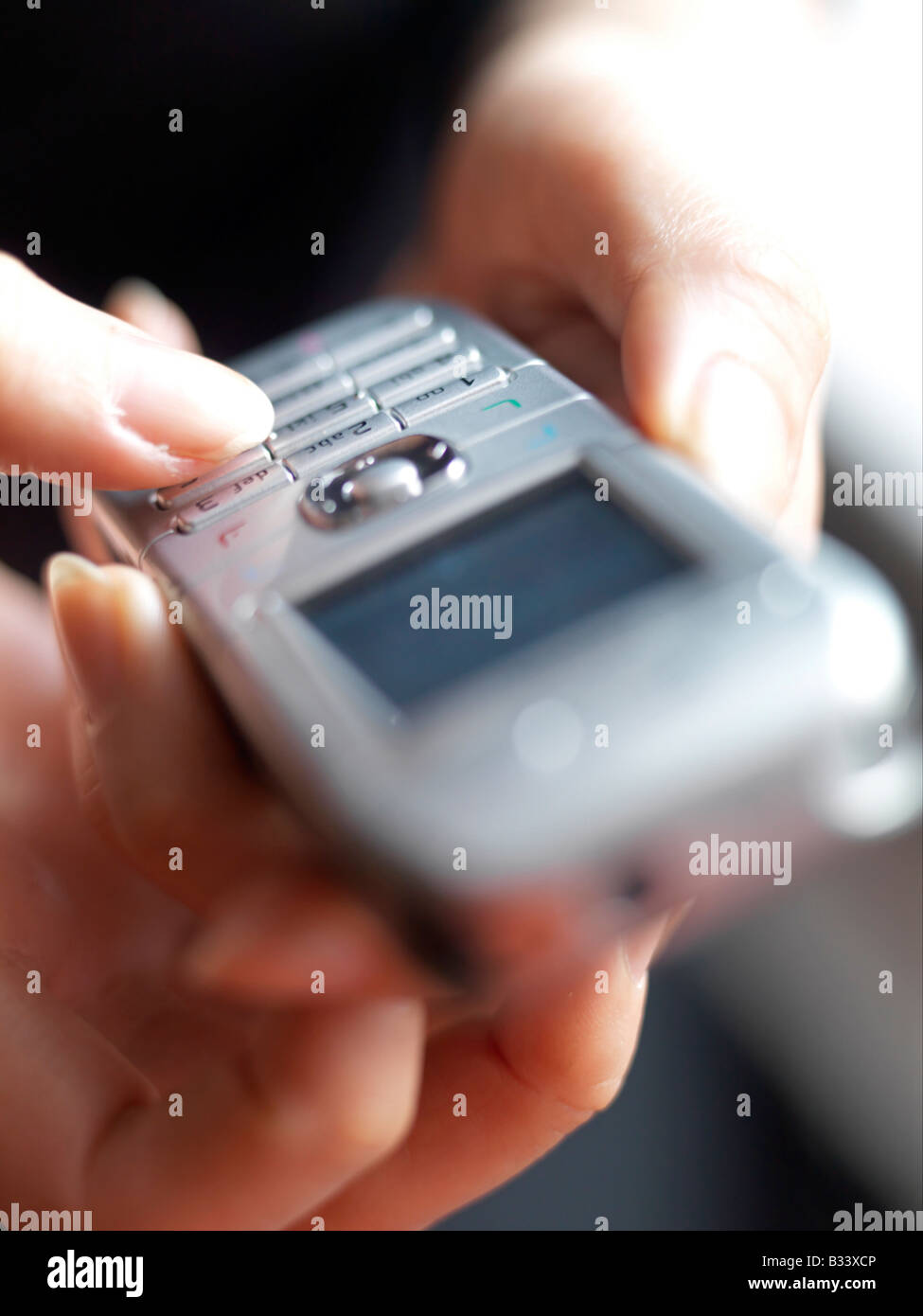A close up view of female hands using a mobile phone Stock Photo - Alamy