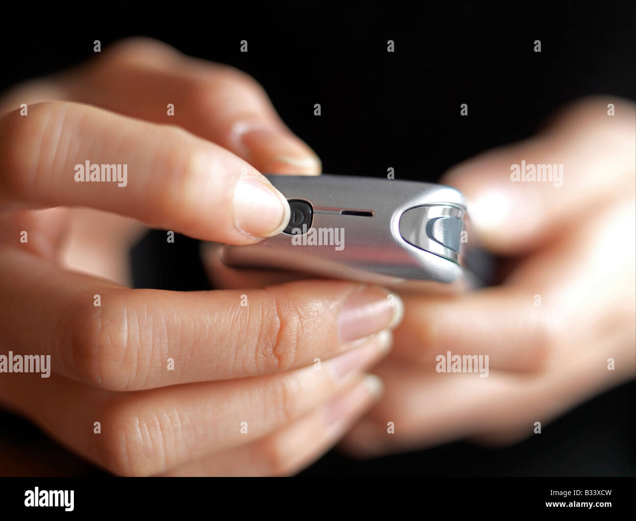 A close up view of female hands using a mobile phone Stock Photo - Alamy