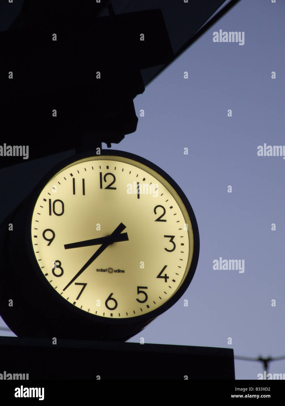clock in city at night Stock Photo - Alamy