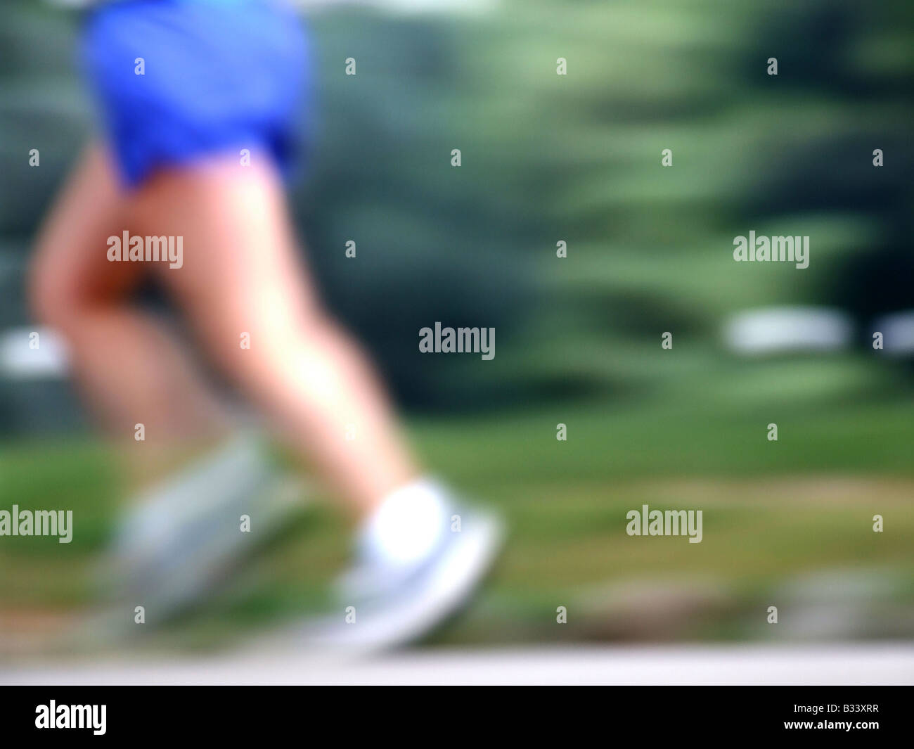 abstract feet of fast runner in park Stock Photo - Alamy
