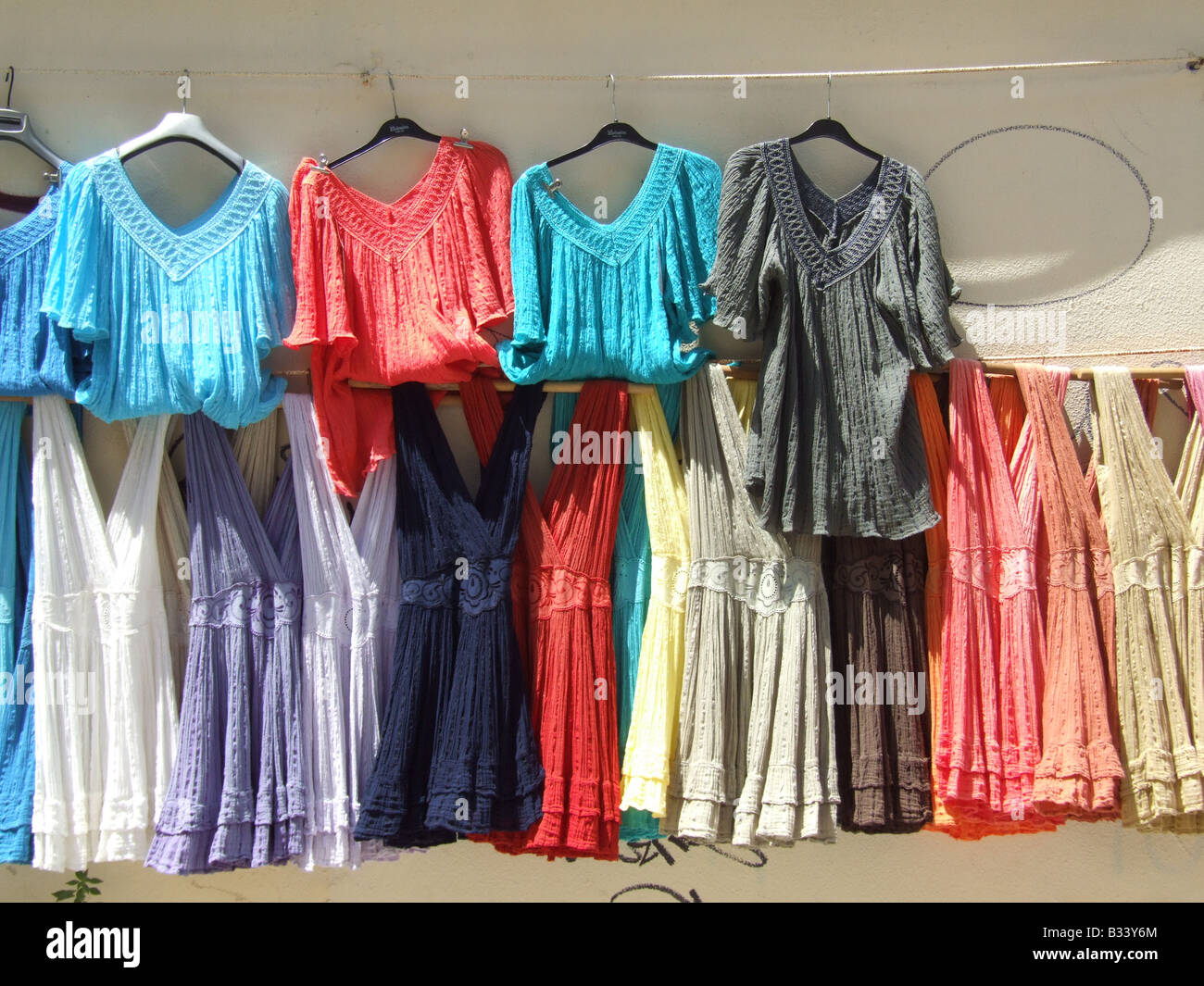 colourful dresses on market stall in athens greece Stock Photo - Alamy