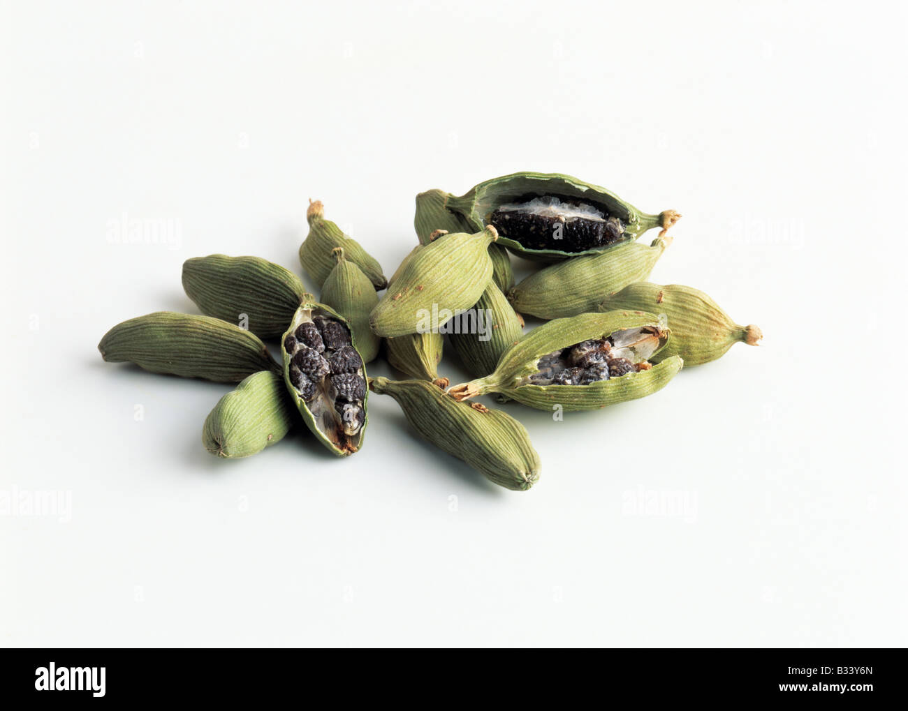 A pile of cardamom pods on a white background editorial food Stock ...