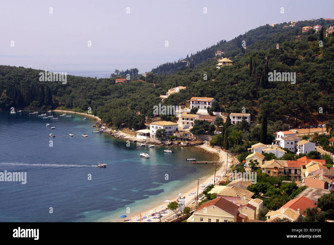 THE PICTURESQUE VILLAGE OF KALAMI ON THE NORTHEAST COAST OF CORFU ...