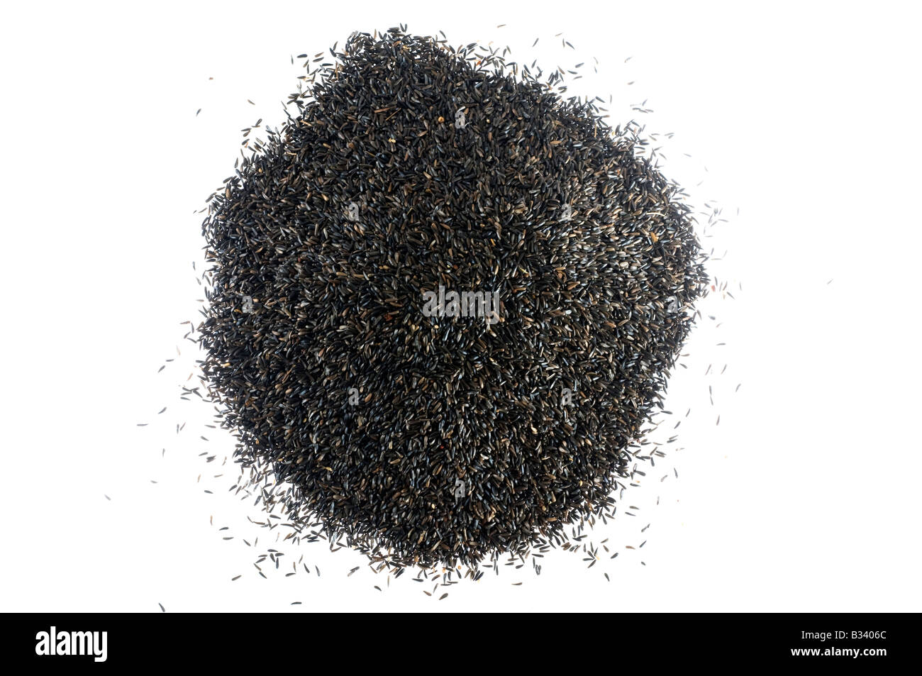 Pile of black niger seed Stock Photo - Alamy