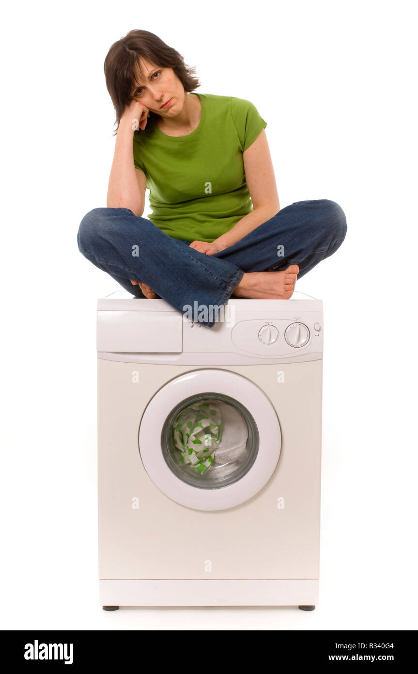 Woman washing machine cross hi-res stock photography and images - Alamy