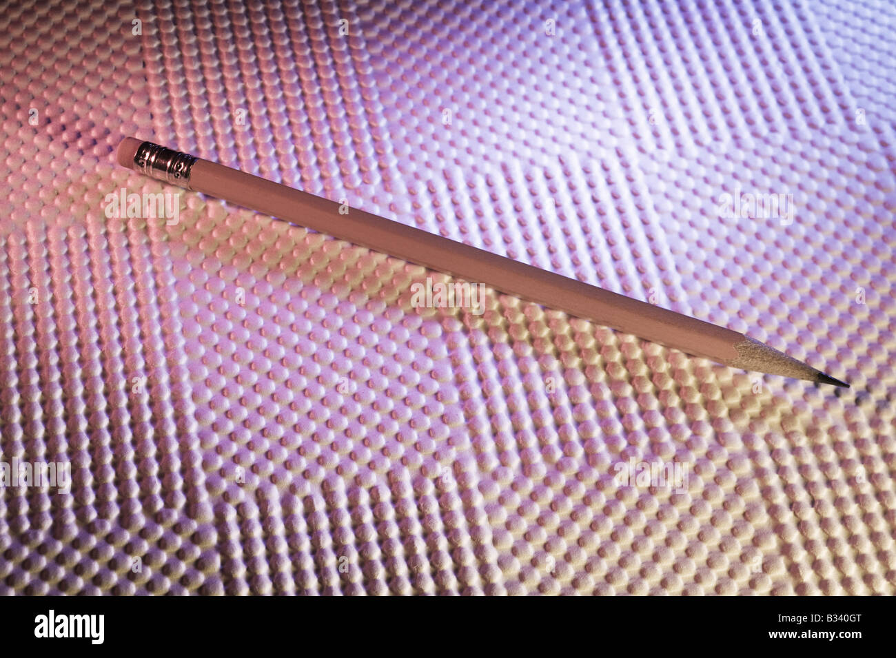 Lead pencil against a crosshatch background Stock Photo - Alamy