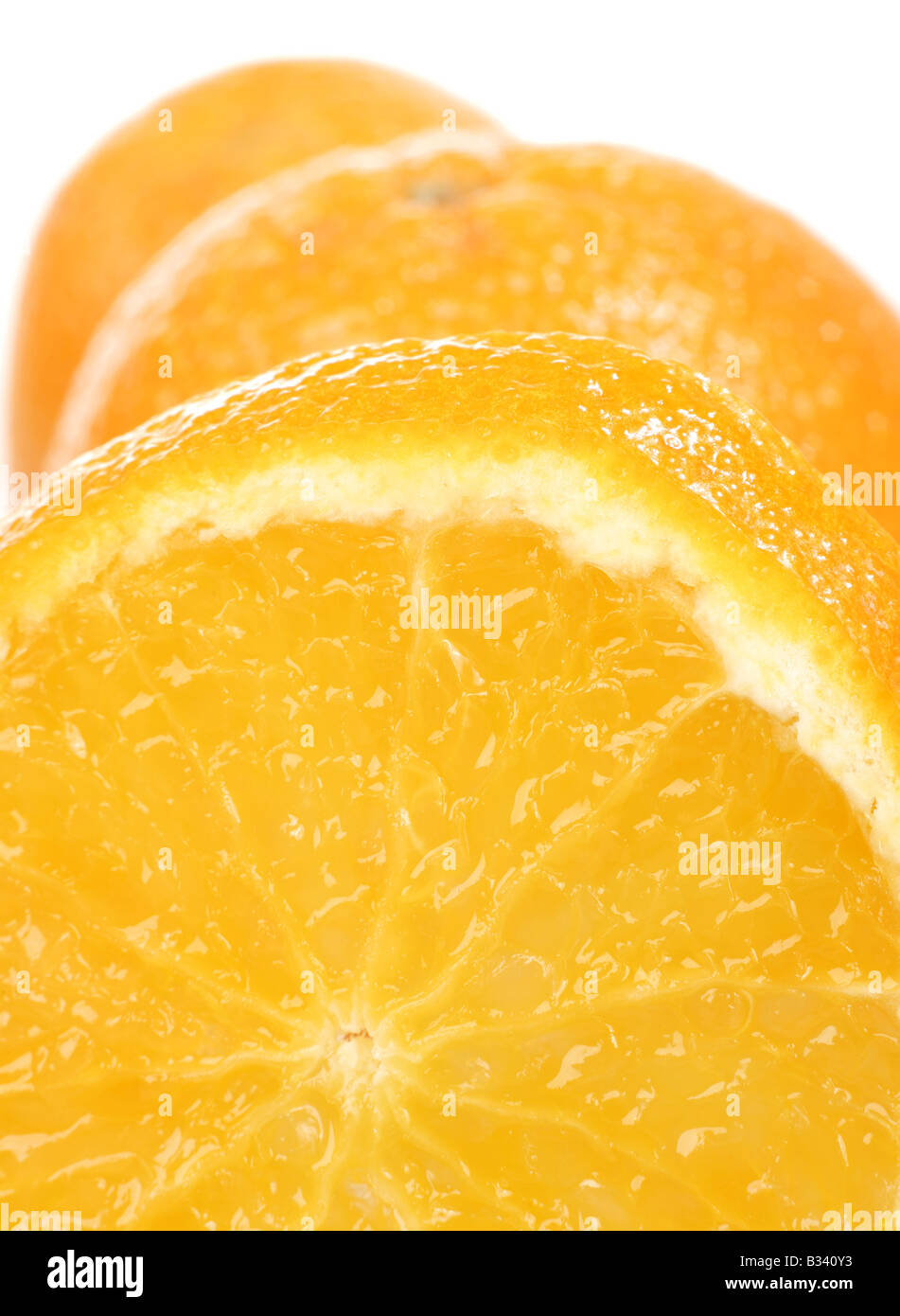 Orange fruit slice detail on white background Stock Photo - Alamy