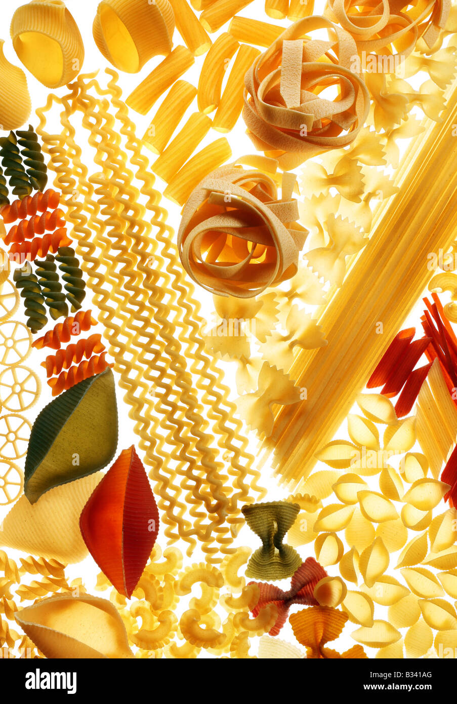 Raw color pasta mix closeup background Stock Photo - Alamy