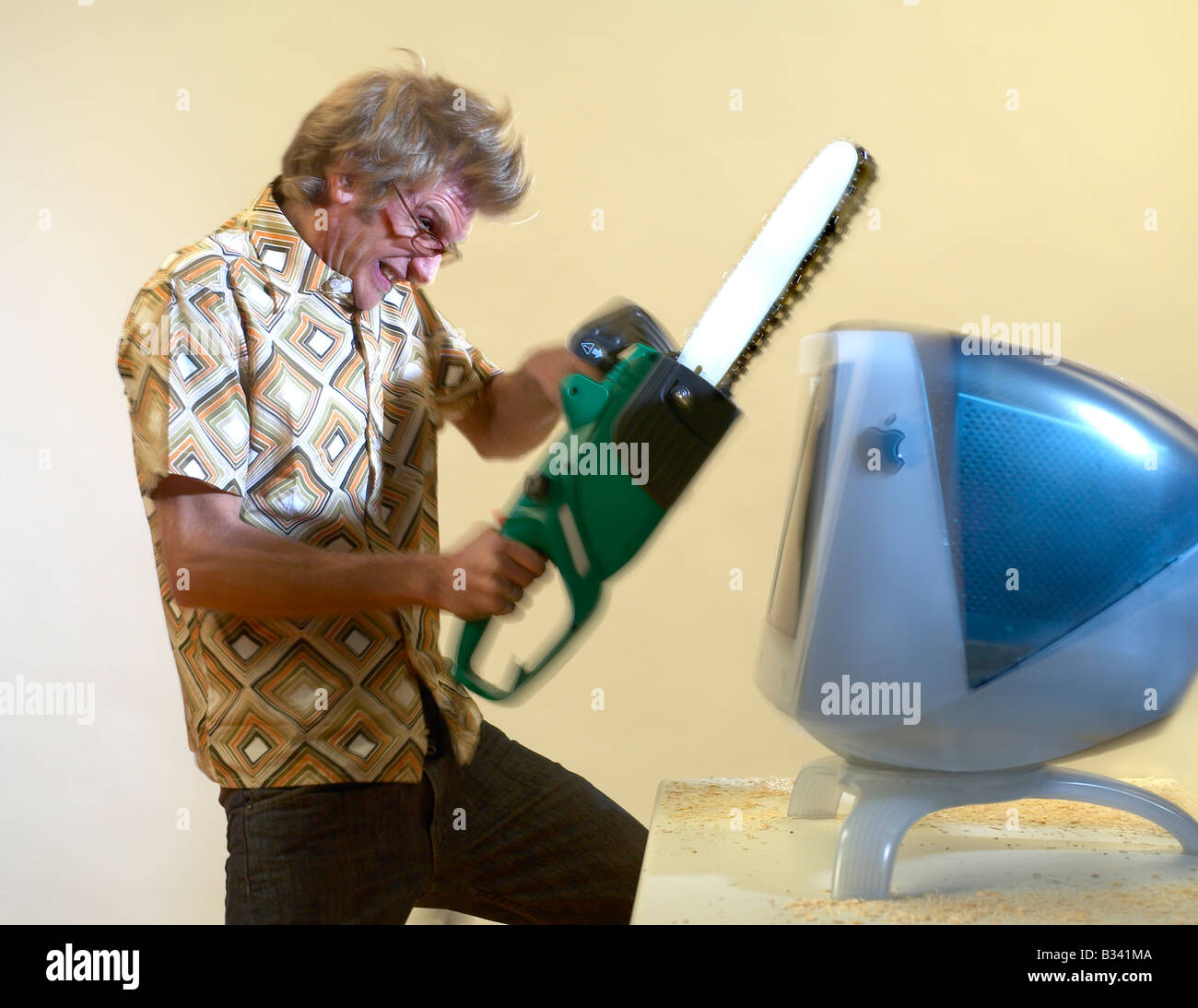 MAN WITH CHAINSAW ATTACKS COMPUTER Stock Photo - Alamy