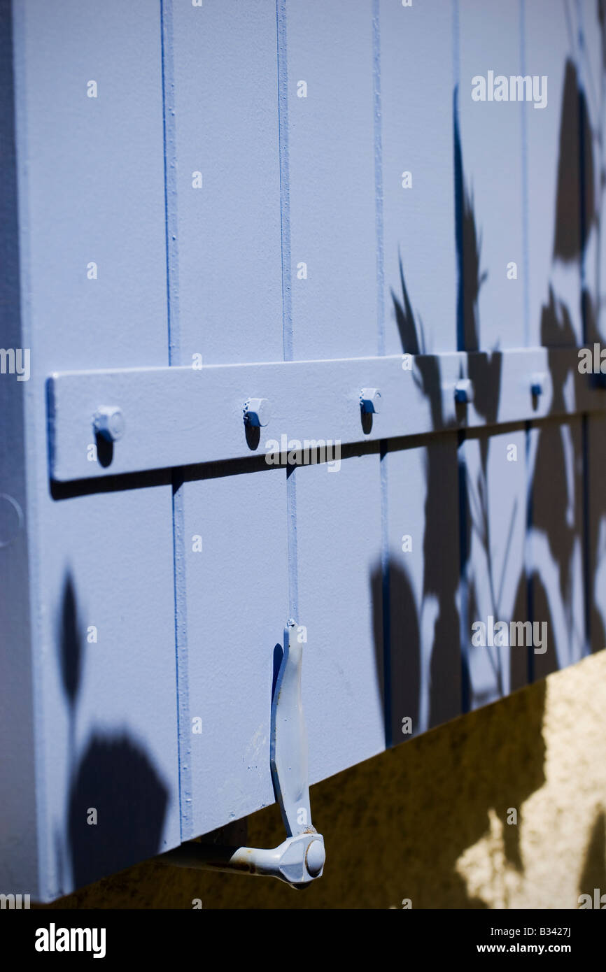 traditional french shutters with emphasis on hold back mechanism Stock ...