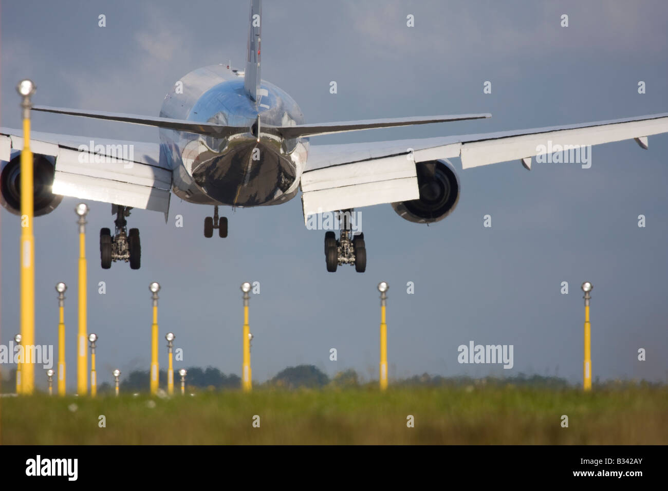 Commercial aeroplane on short final approach to London Heathrow Airport ...