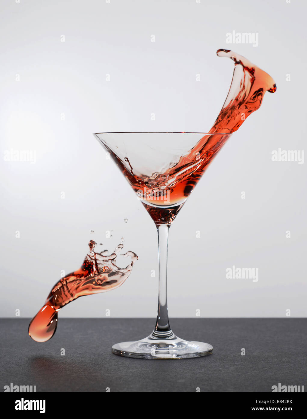 High-speed cocktail glass splash Stock Photo - Alamy