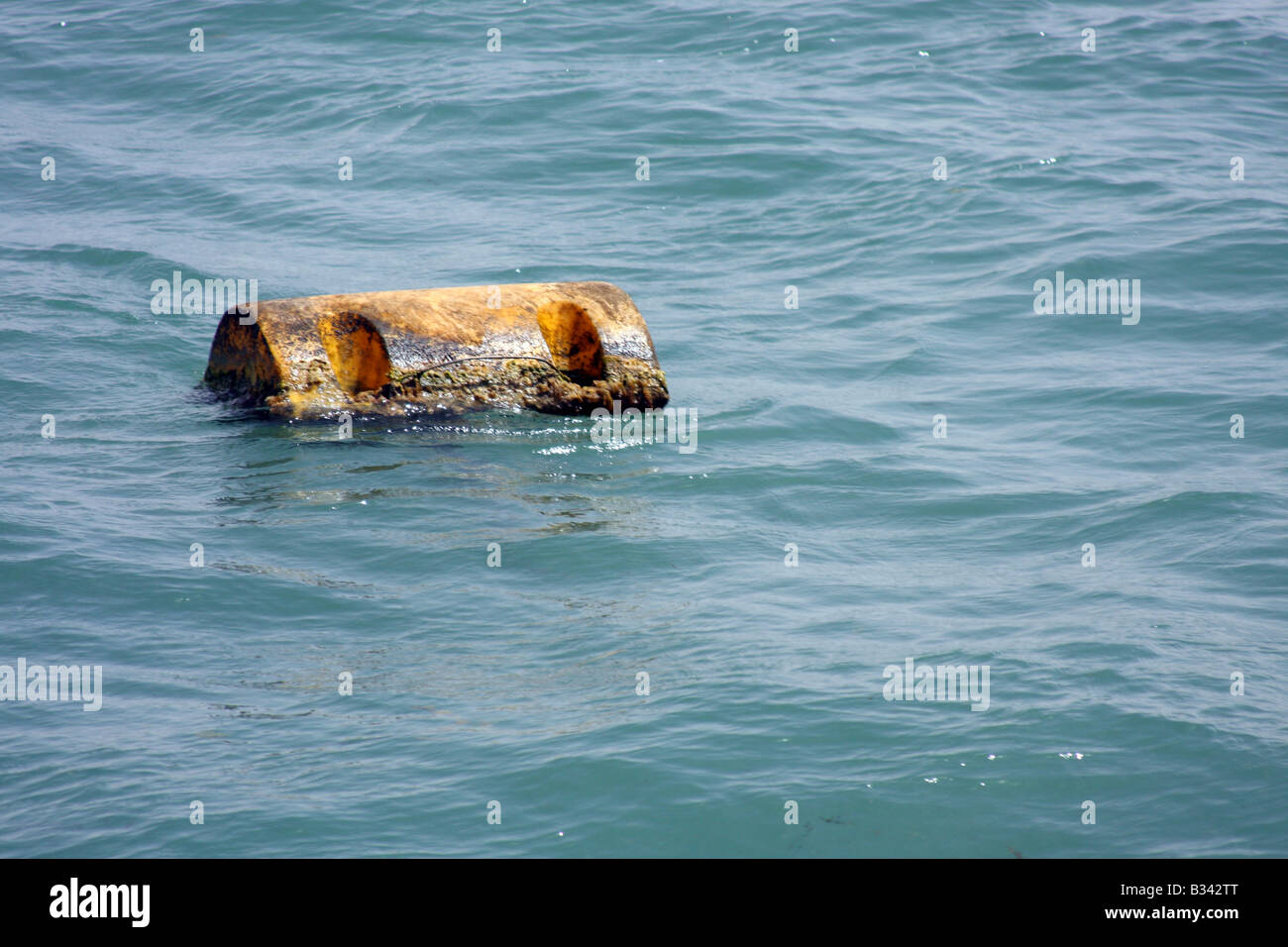 Old buoy in the sea Stock Photo - Alamy