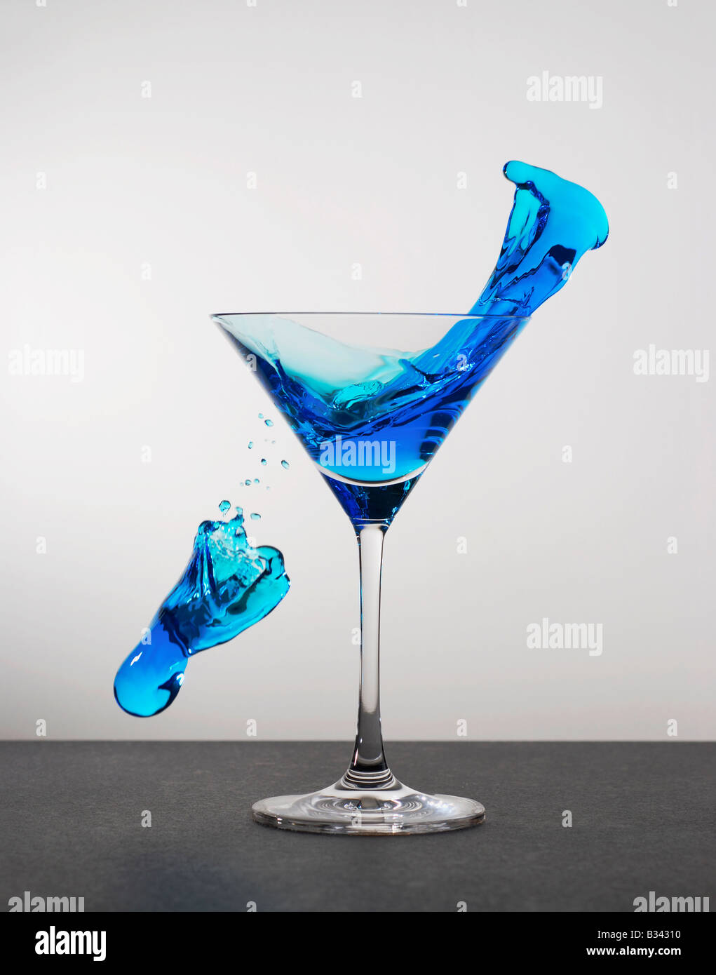 High-speed cocktail glass splash Stock Photo - Alamy