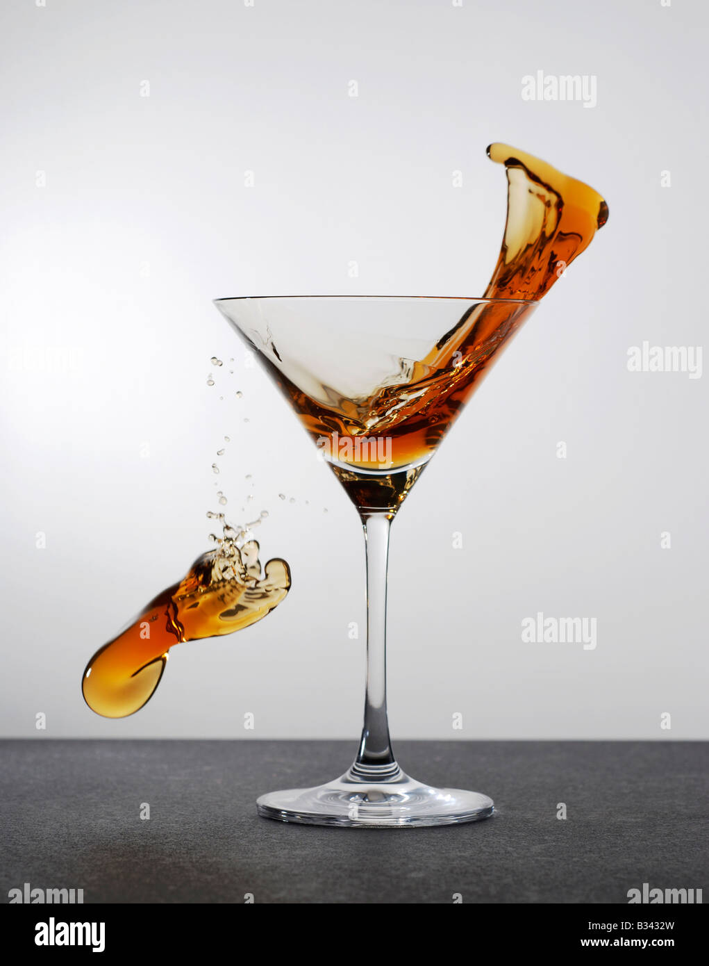 High-speed cocktail glass splash Stock Photo - Alamy
