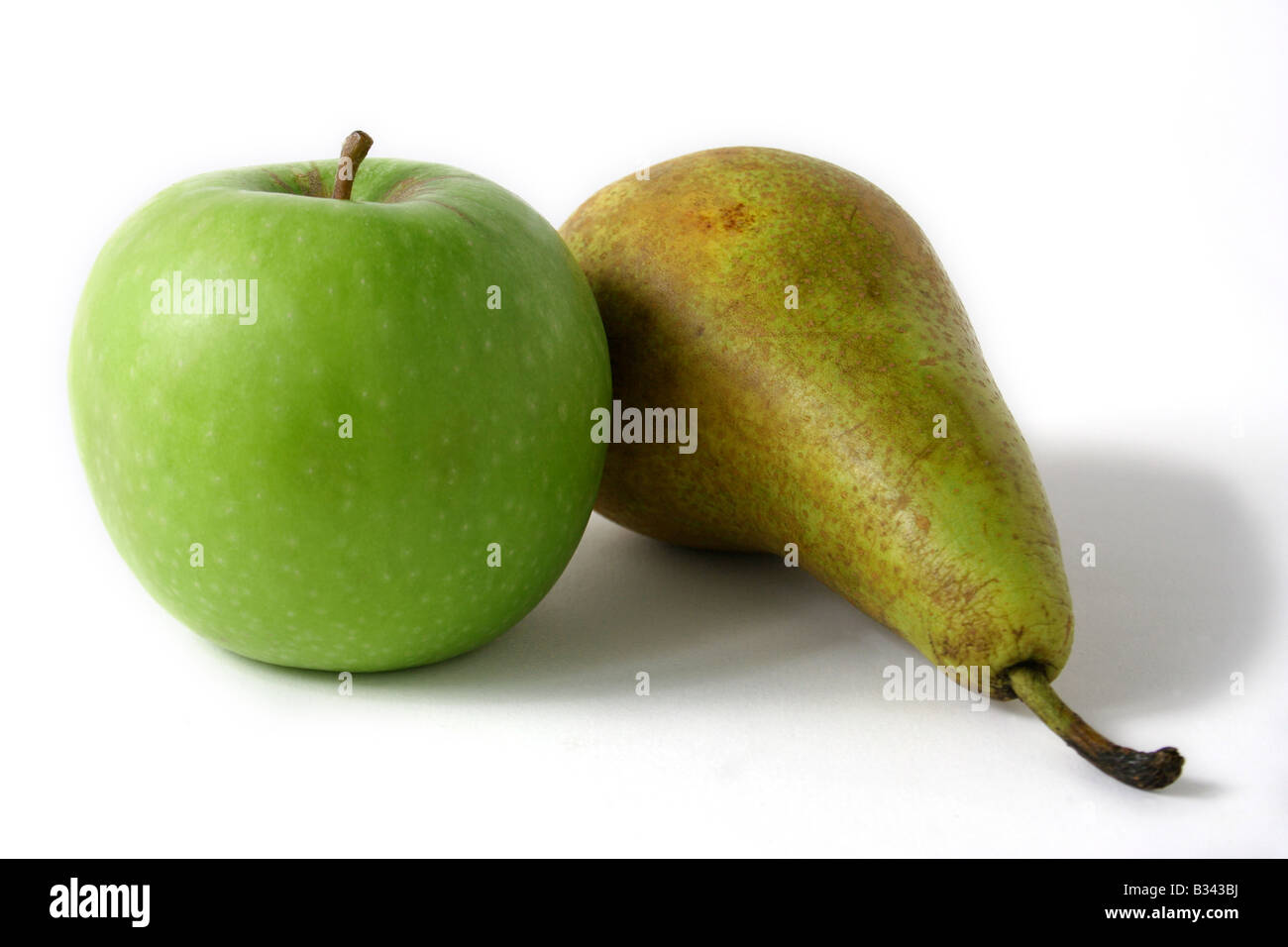 An apple and a pear Stock Photo - Alamy