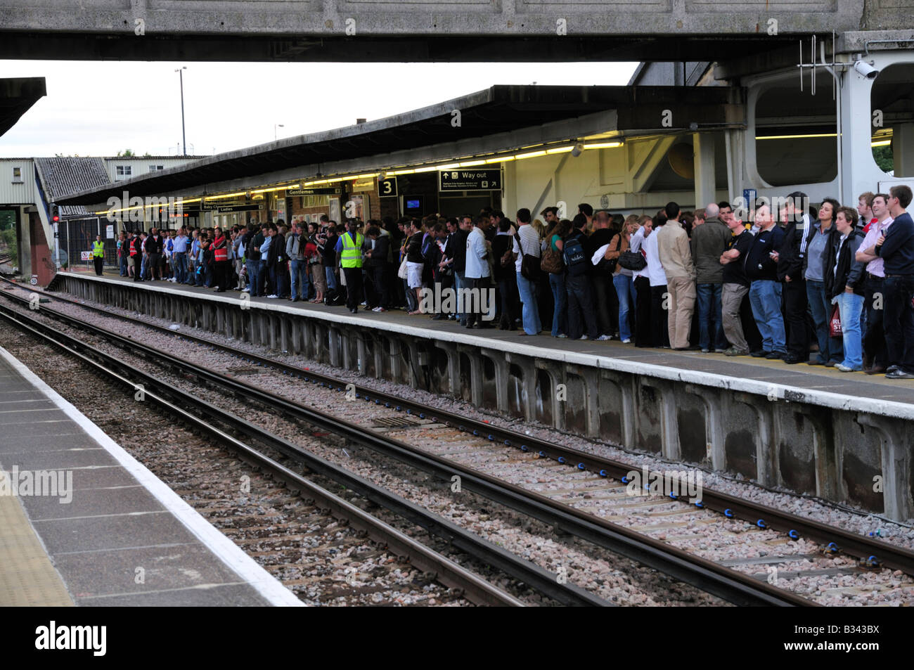 Crowded platform at Twickenham station, London, UK after a rugby game 2 ...
