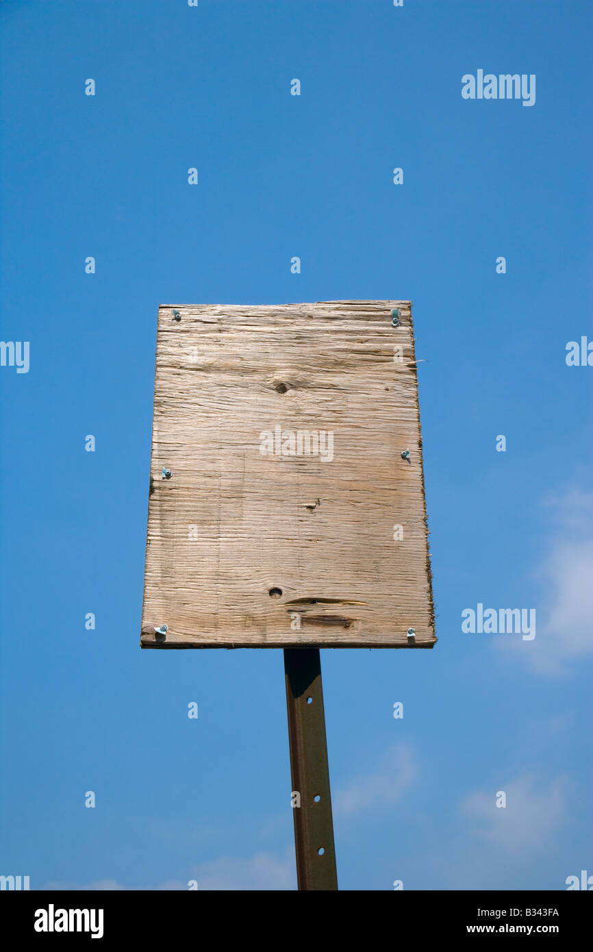 Blank wooden sign in a blue sky Stock Photo - Alamy