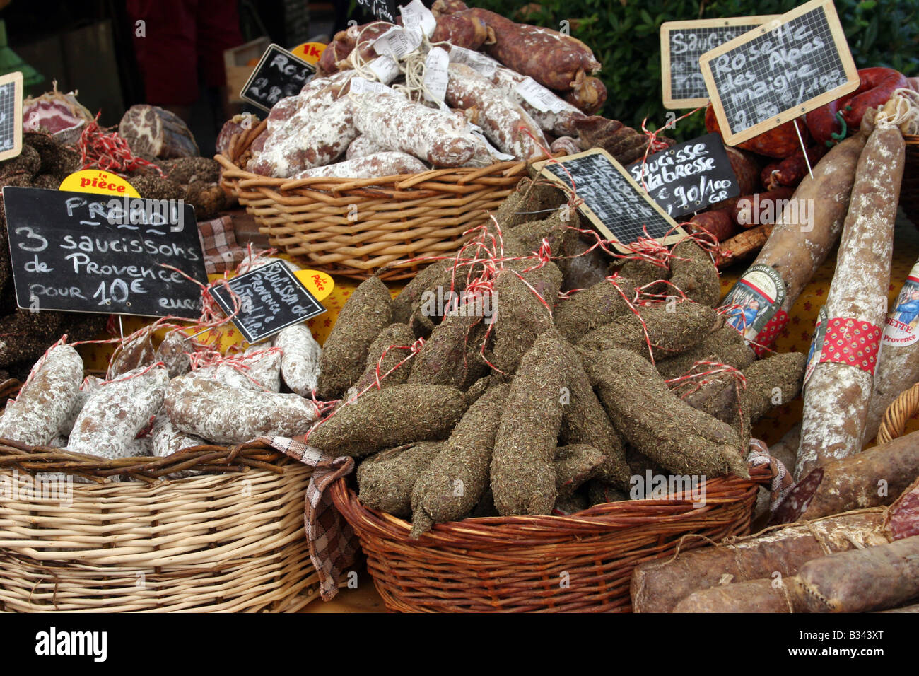 variety of saucissons at a meat market stall in the french alps ...