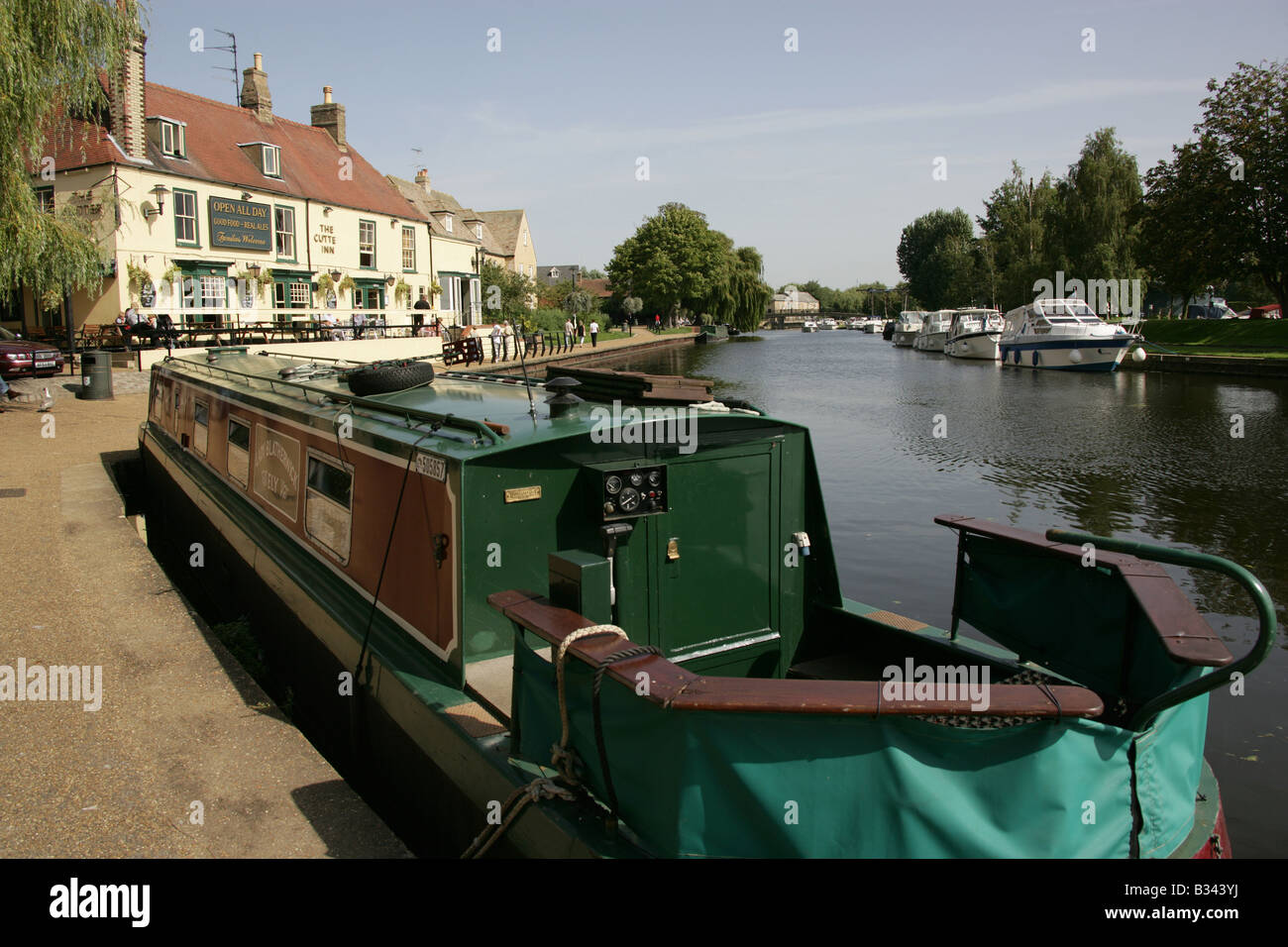 City of Ely, England. Ely’s Great Ouse River with visitors and boat ...