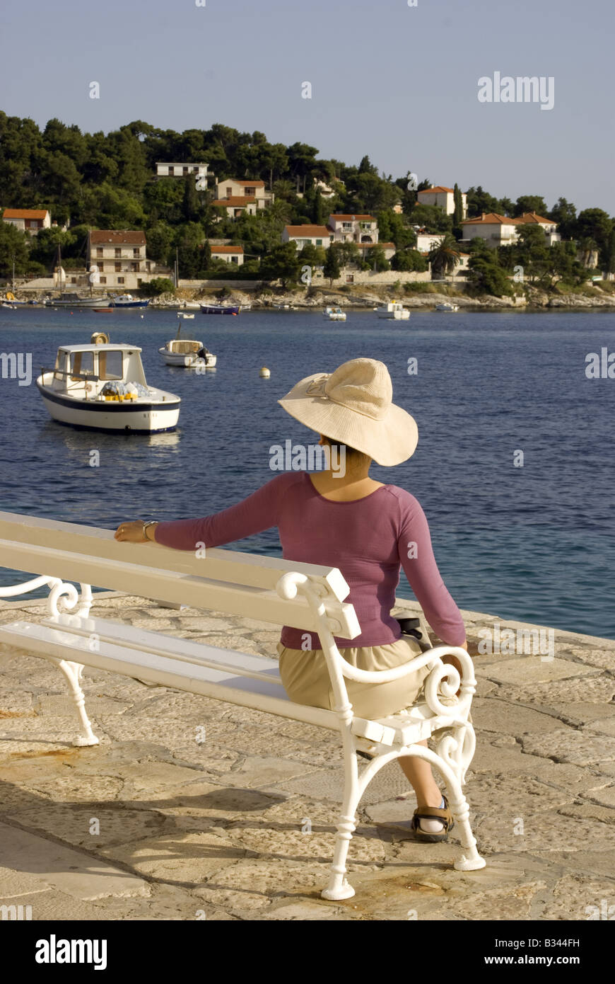 Hvar harbour waterfront bench on island of Hvar in Adriatic Stock Photo ...