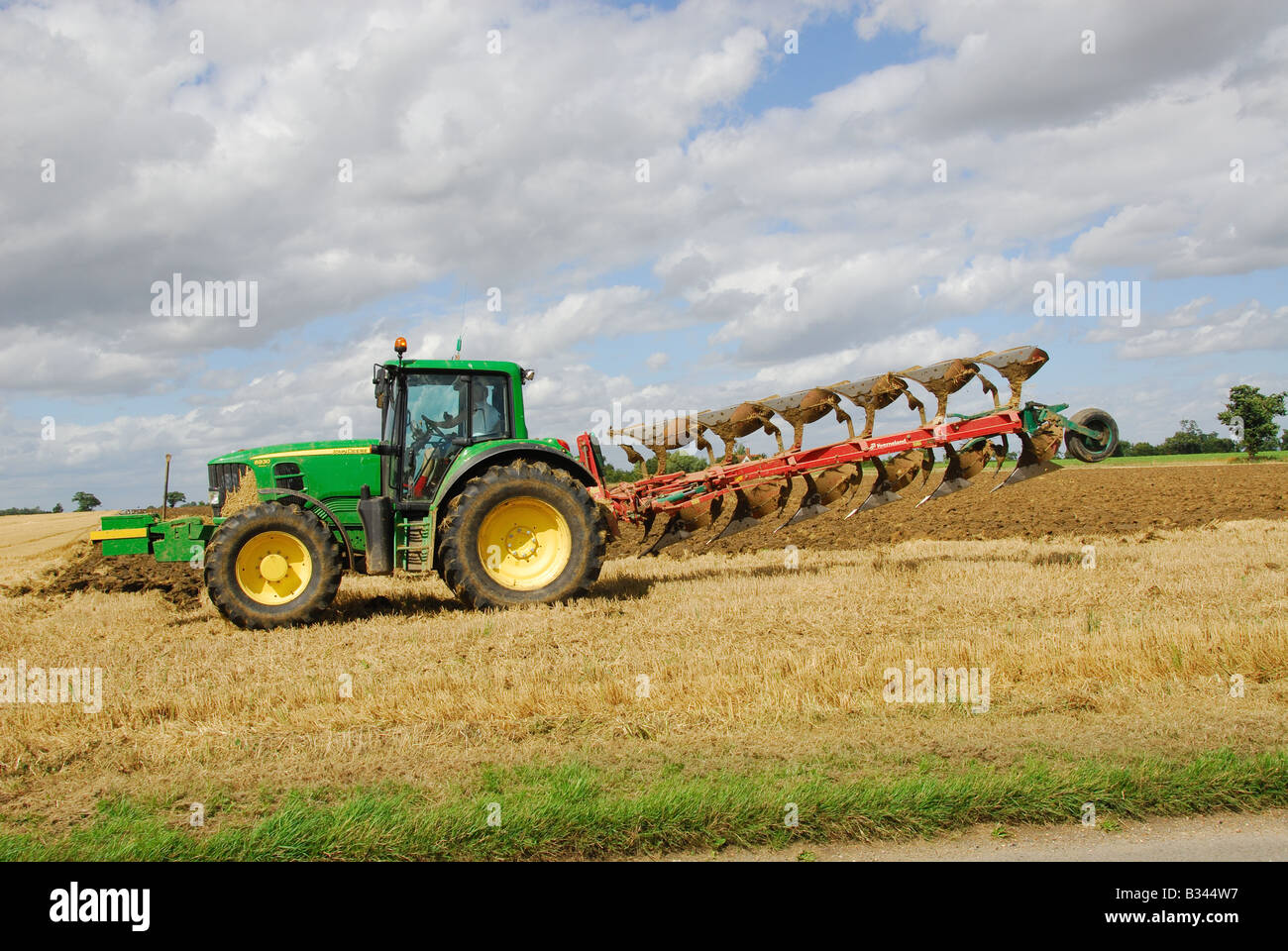 Tractor turning on headland Stock Photo - Alamy
