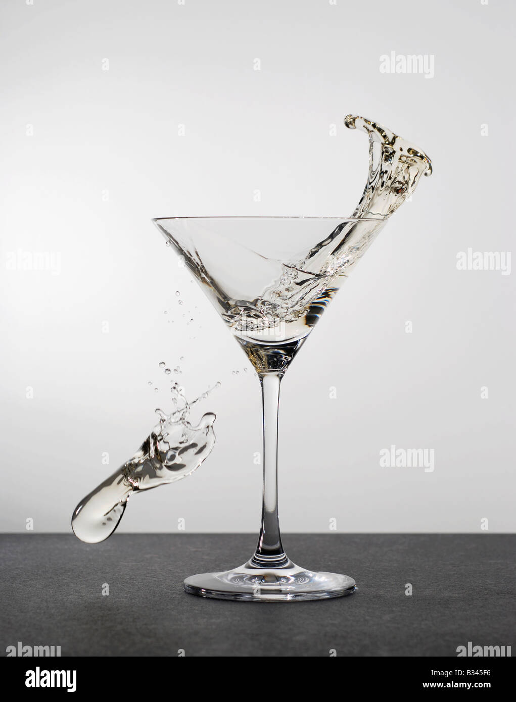 High-speed cocktail glass splash Stock Photo - Alamy