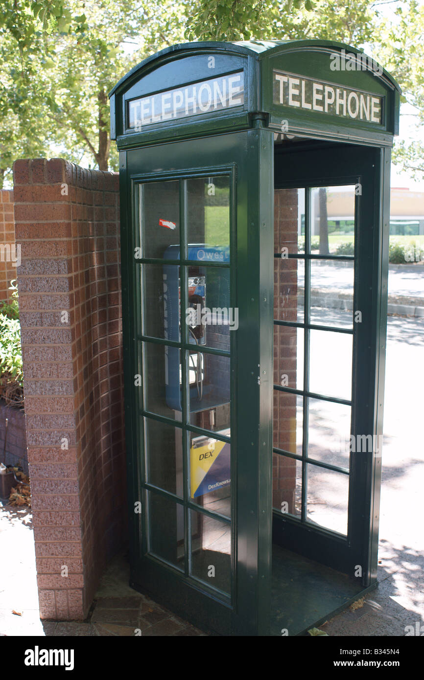 An older green public phone booth in an uptown district Stock Photo - Alamy