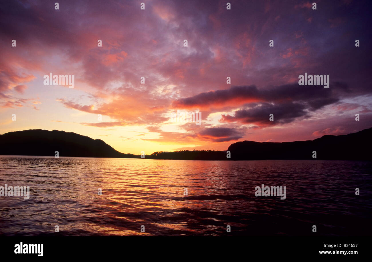 dusk in Selje on peninsula Stadlandet in Norway; silhouette of island ...