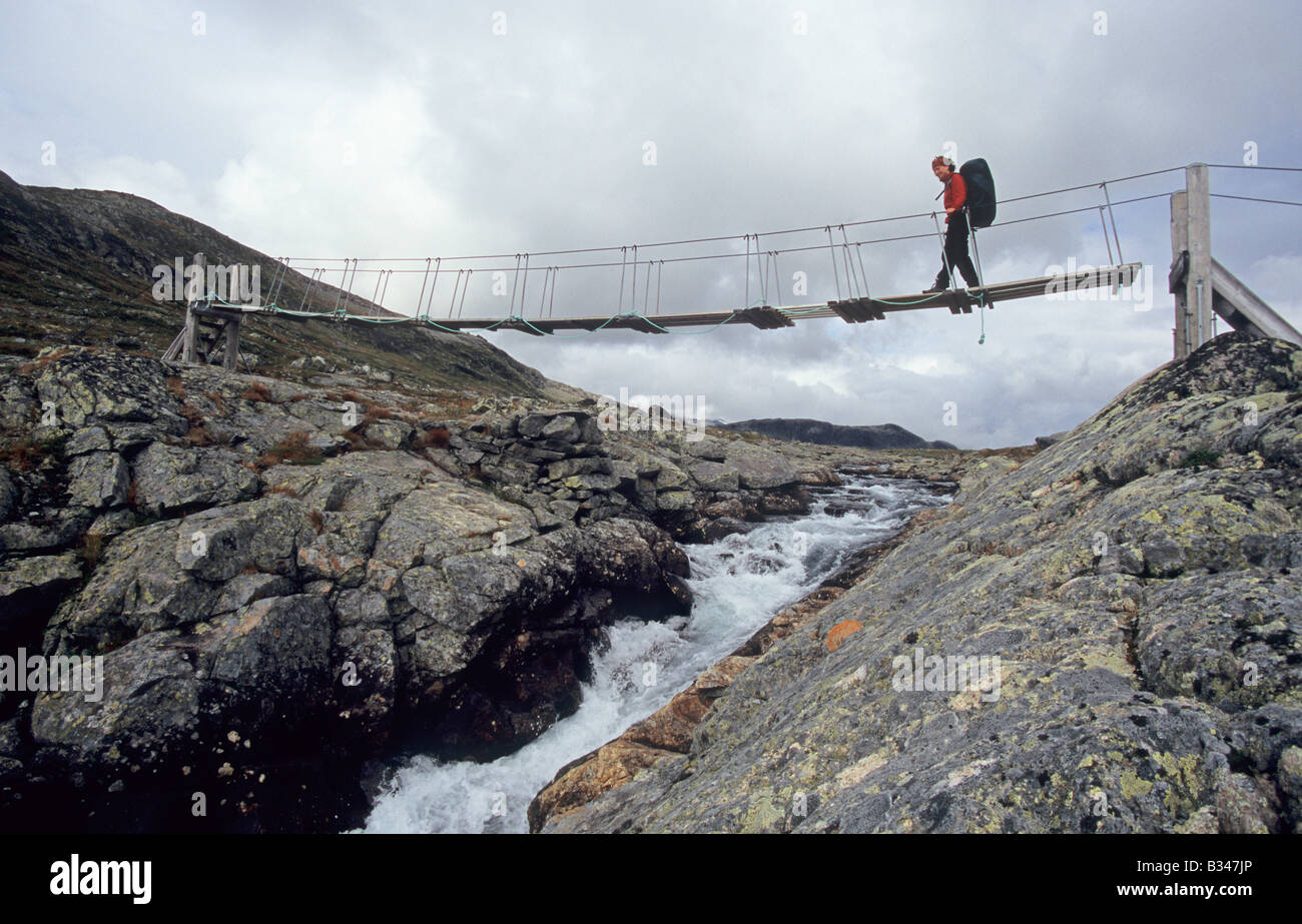 woman on a rope bridge in Jotunheimen, Norway Stock Photo - Alamy