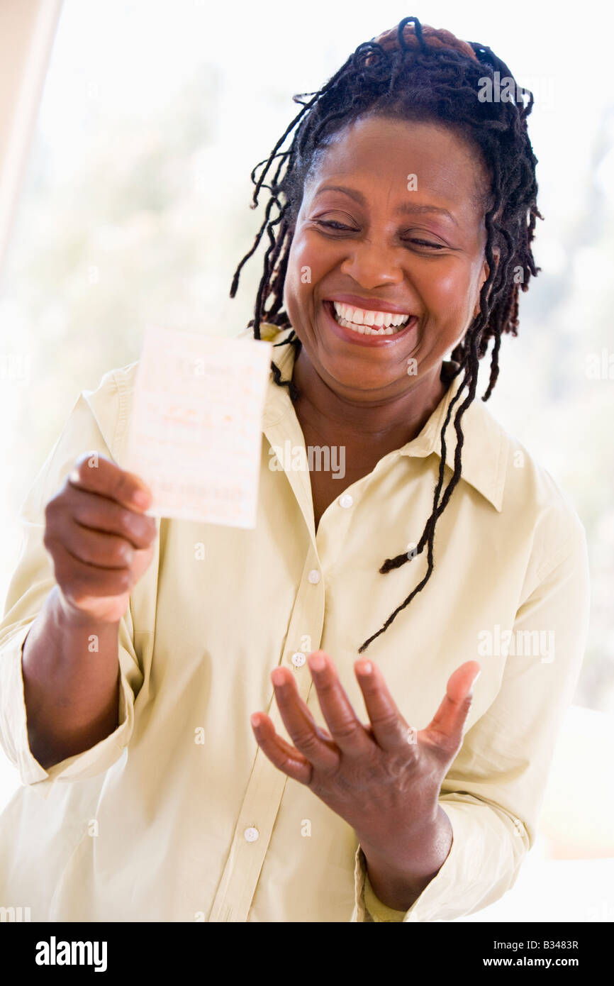 Woman with winning lottery ticket excited and smiling Stock Photo - Alamy