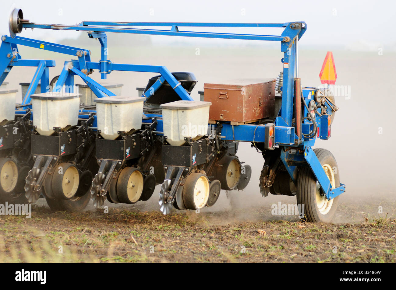 John Deere tractor planting corn or soybeans in an American farm field ...