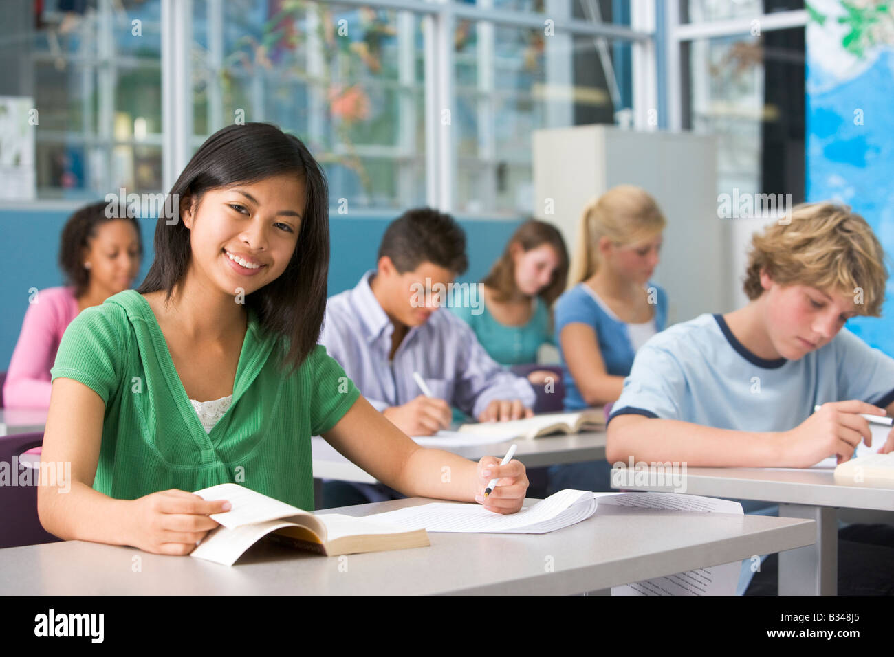 Students studying in geography class Stock Photo - Alamy