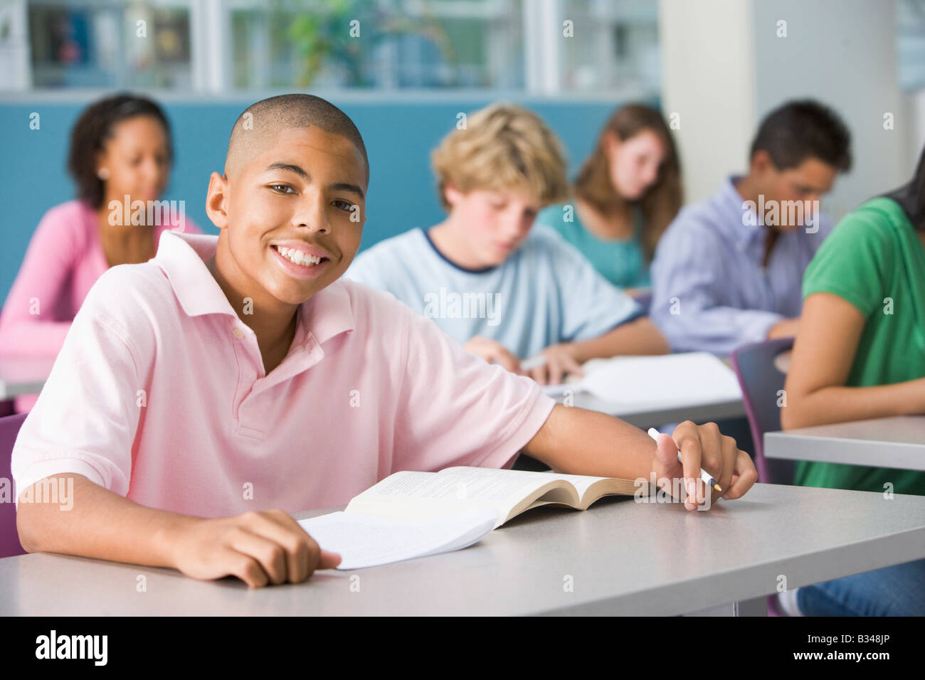 Students studying in geography class Stock Photo - Alamy