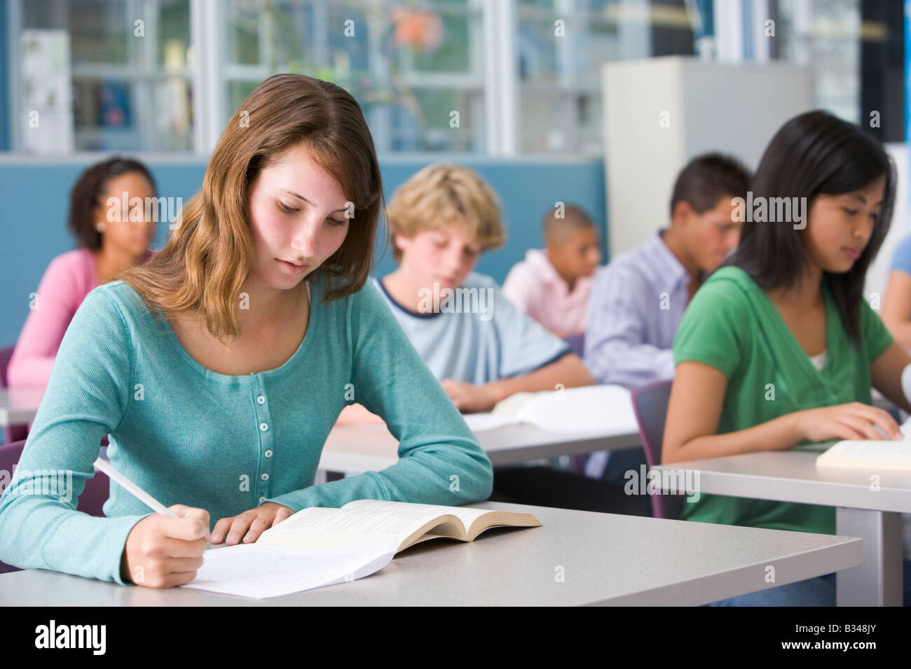 Students studying in geography class Stock Photo - Alamy